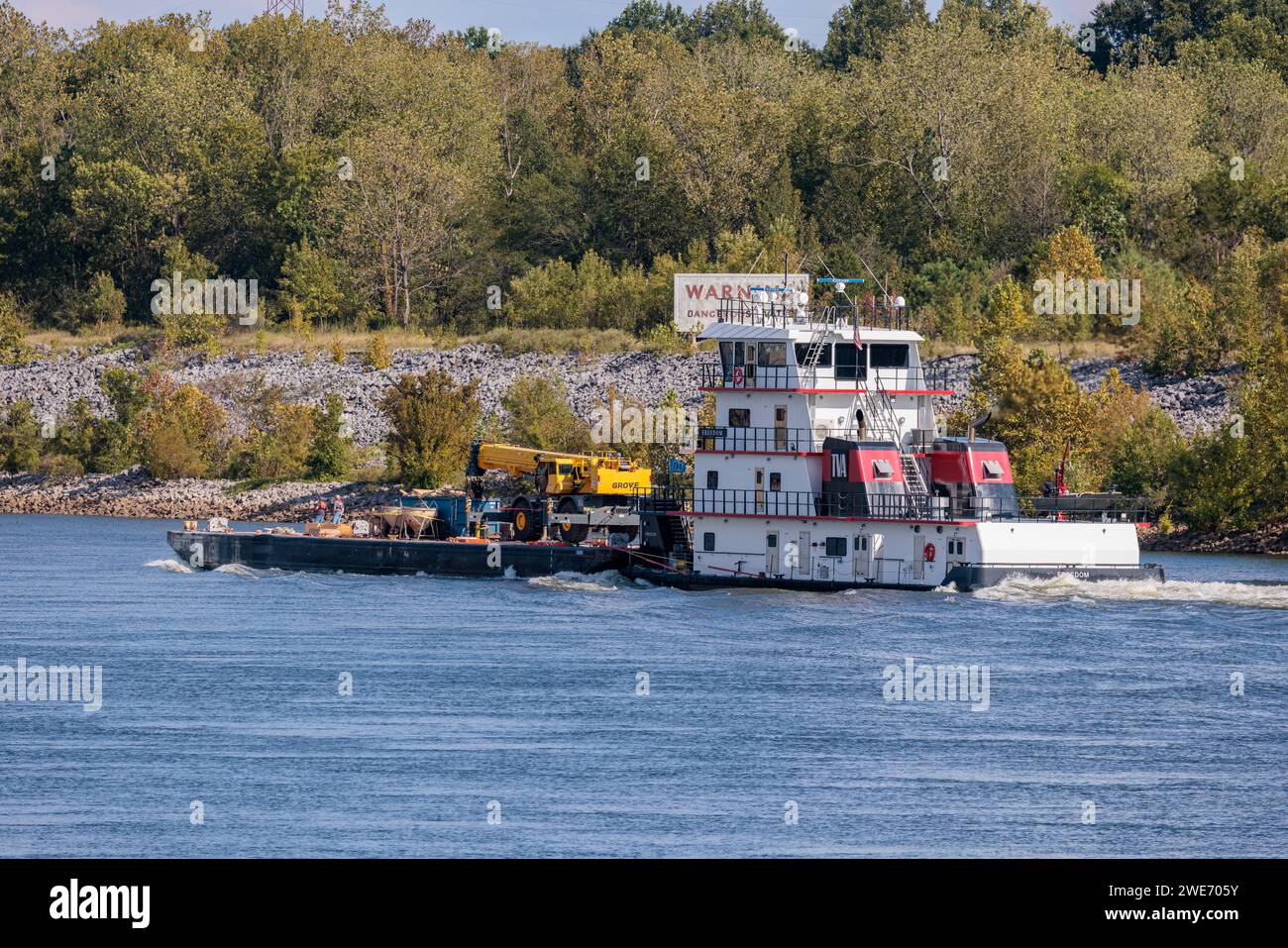 Tennessee Valley Authority tug boat Freedom pushing a barge with ...