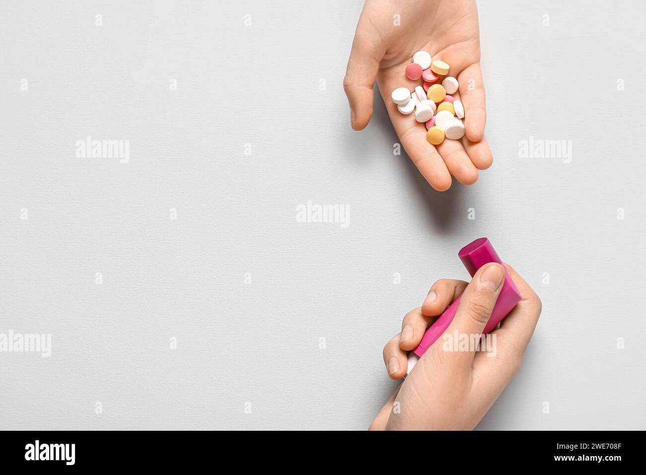 Child's hands with asthma inhaler and pills on white background Stock ...