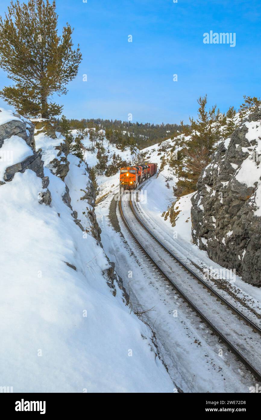 train below mullan pass on the continental divide in winter near austin ...