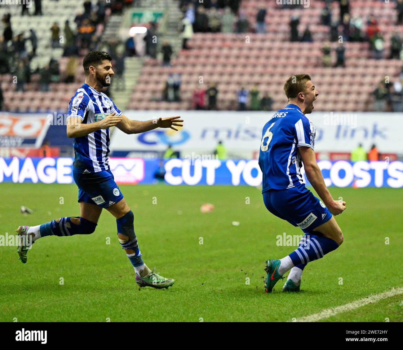 Charlie Hughes of Wigan Athletic celebrates his late goal to make it 1 ...