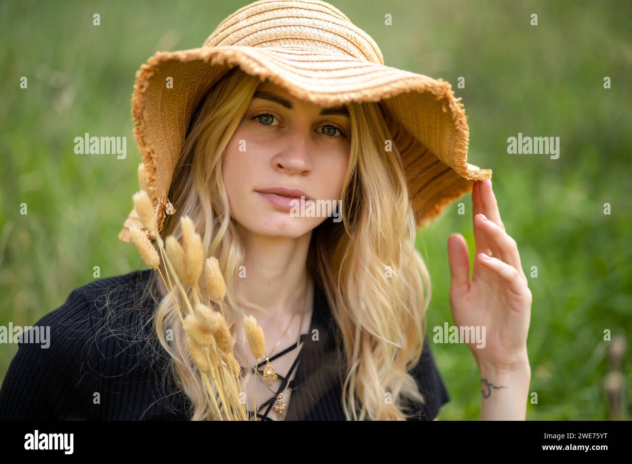portrait of a girl in a straw hat. Natural beauty and lightness, boho ...