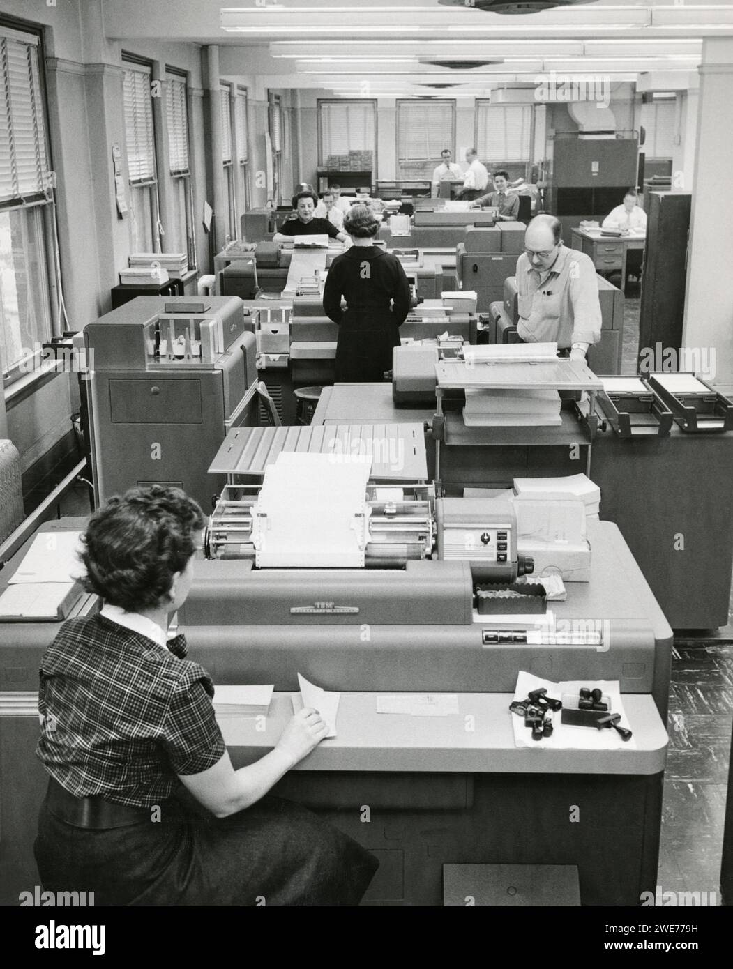 Office workers entering data Stock Photo - Alamy