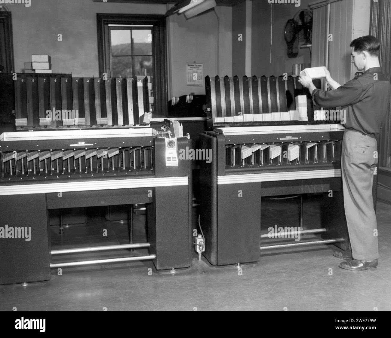 Man loading punch cards Stock Photo - Alamy