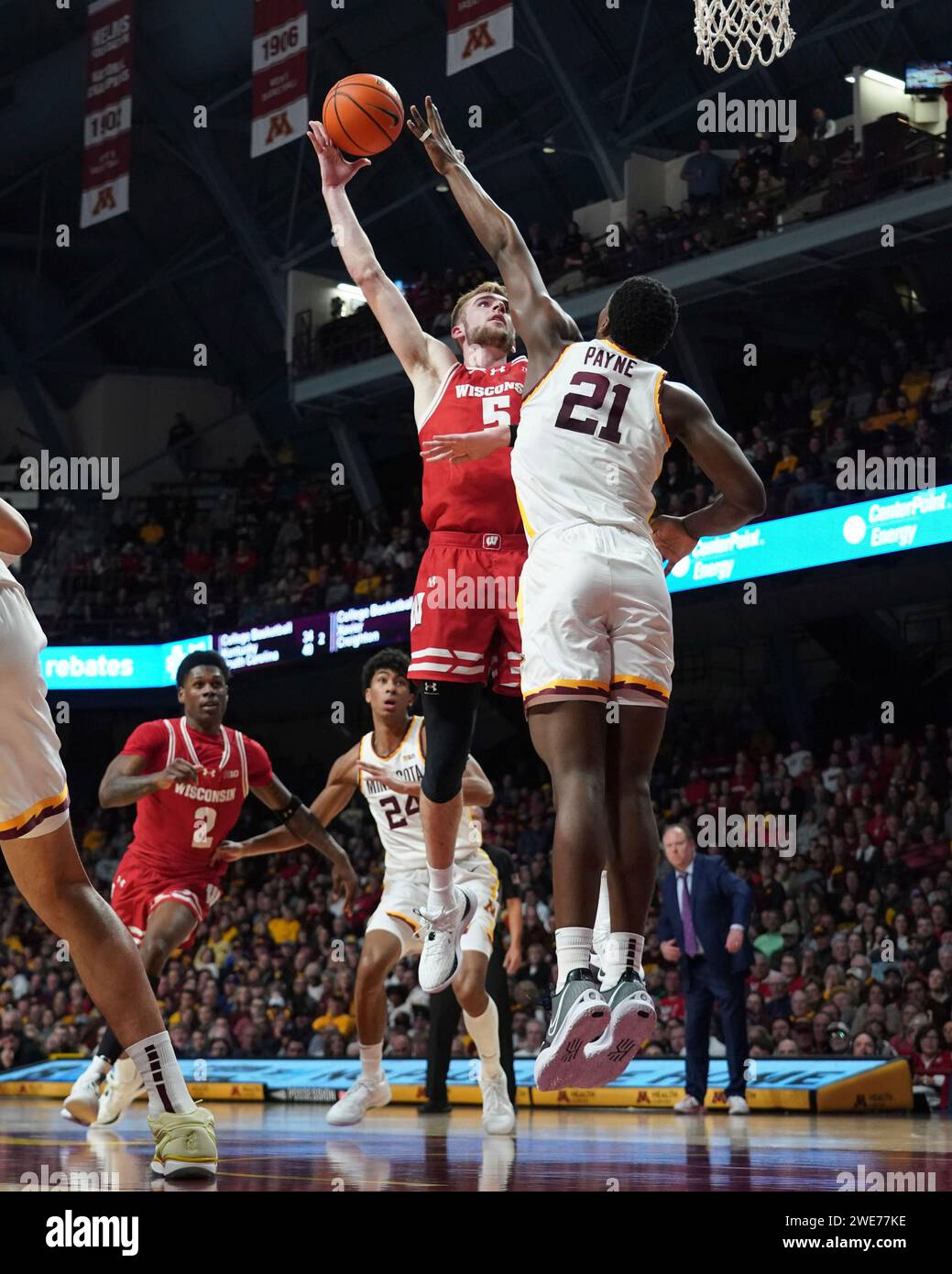 Wisconsin forward Tyler Wahl (5) shoots over Minnesota forward Pharrel ...