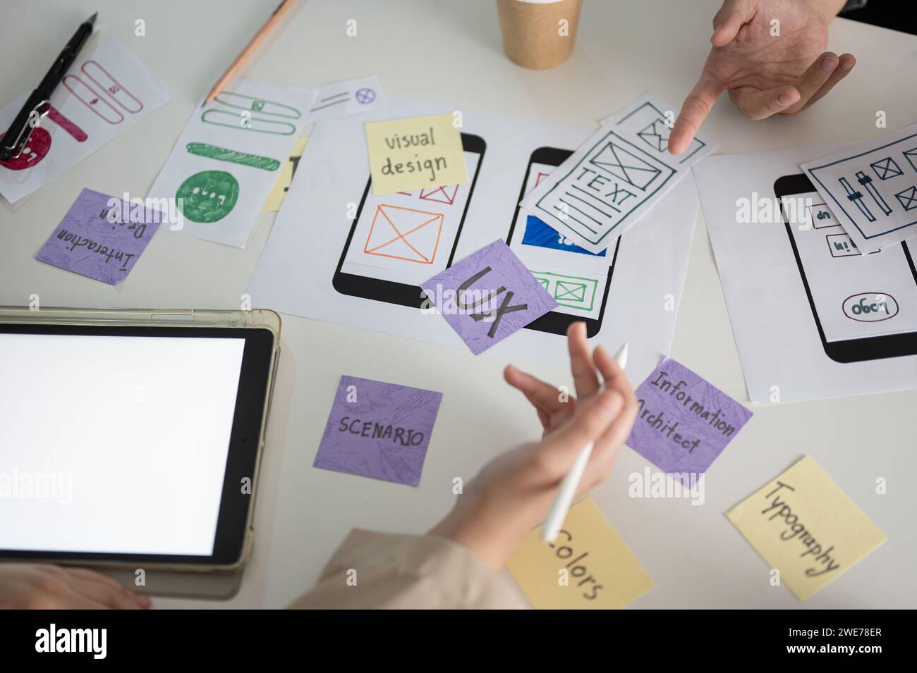 Close-up image of a meeting table with a graphic designer team and ...