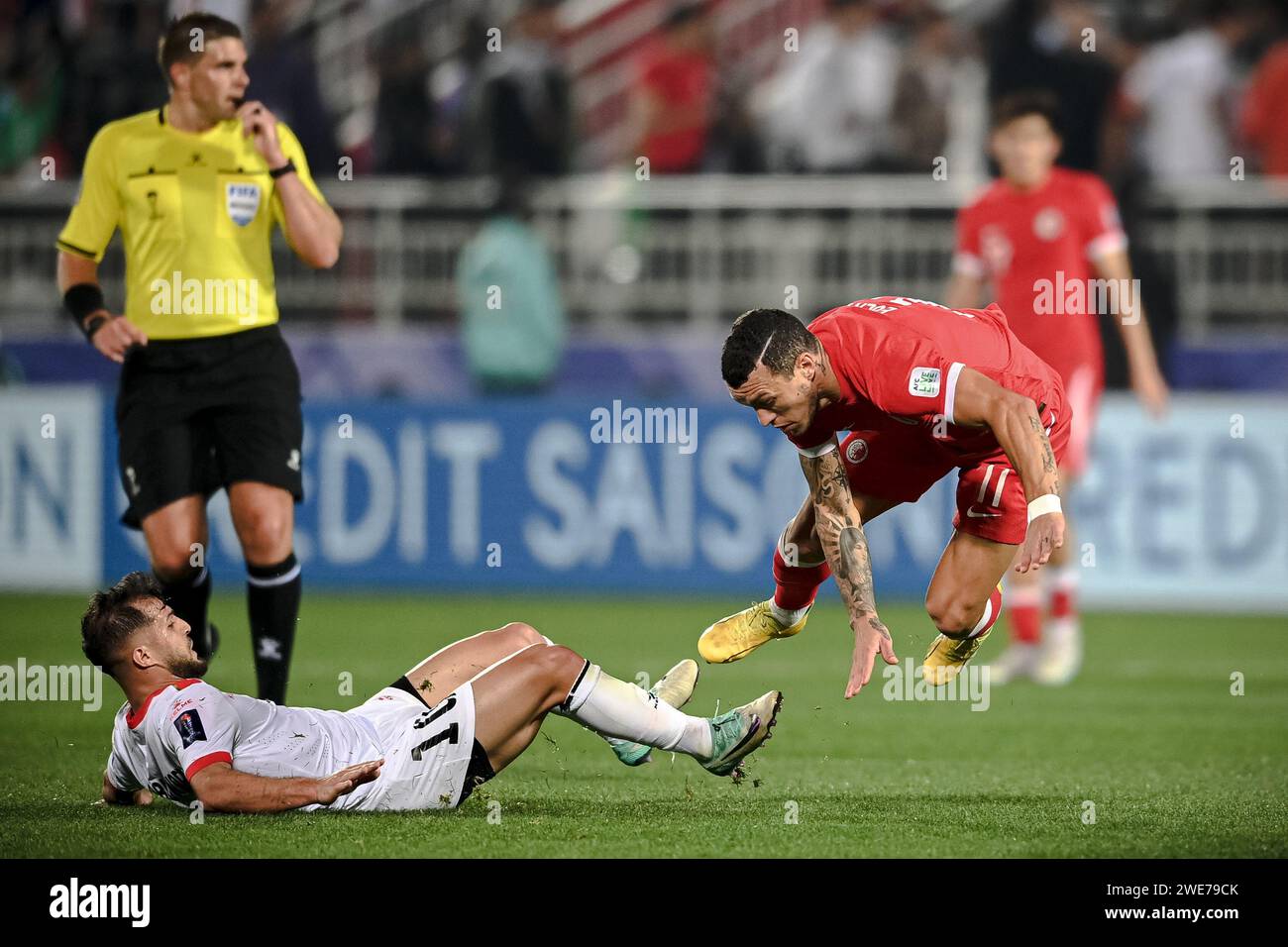 Doha, Qatar. 23rd Jan, 2024. Everton Camargo (R) of China's Hong Kong ...