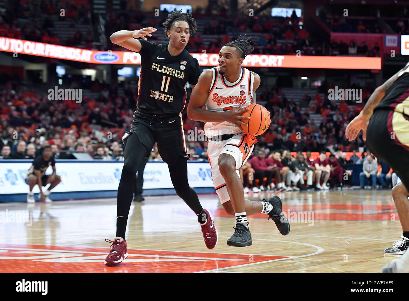 Syracuse guard J.J. Starling, right, drives to the basket against ...