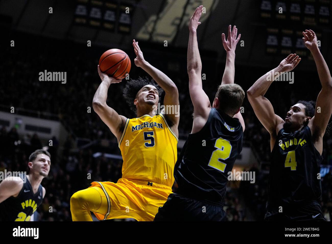 Michigan forward Terrance Williams II (5) shoots over Purdue guard ...