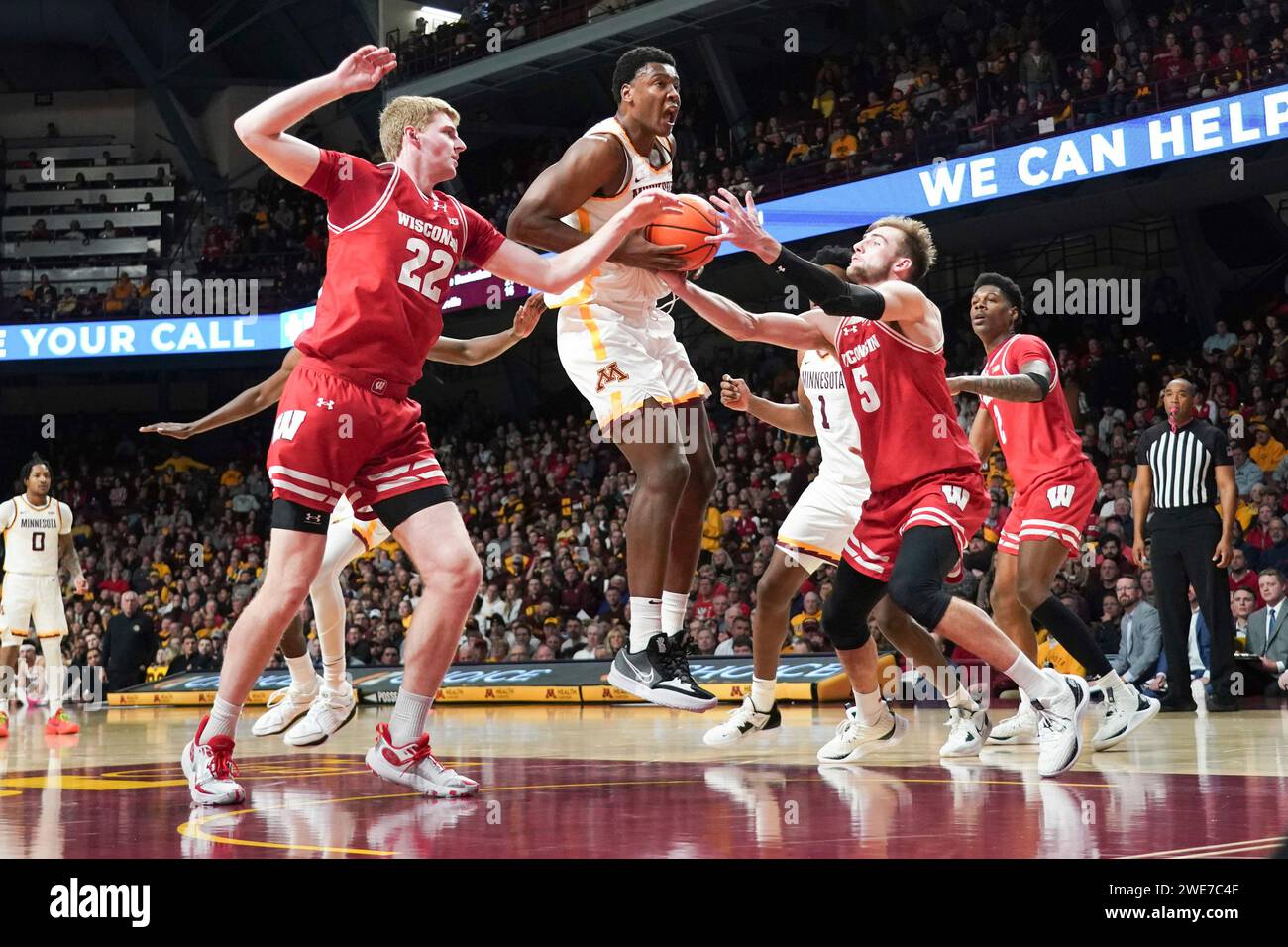 Minnesota forward Pharrel Payne grabs a rebound between Wisconsin ...