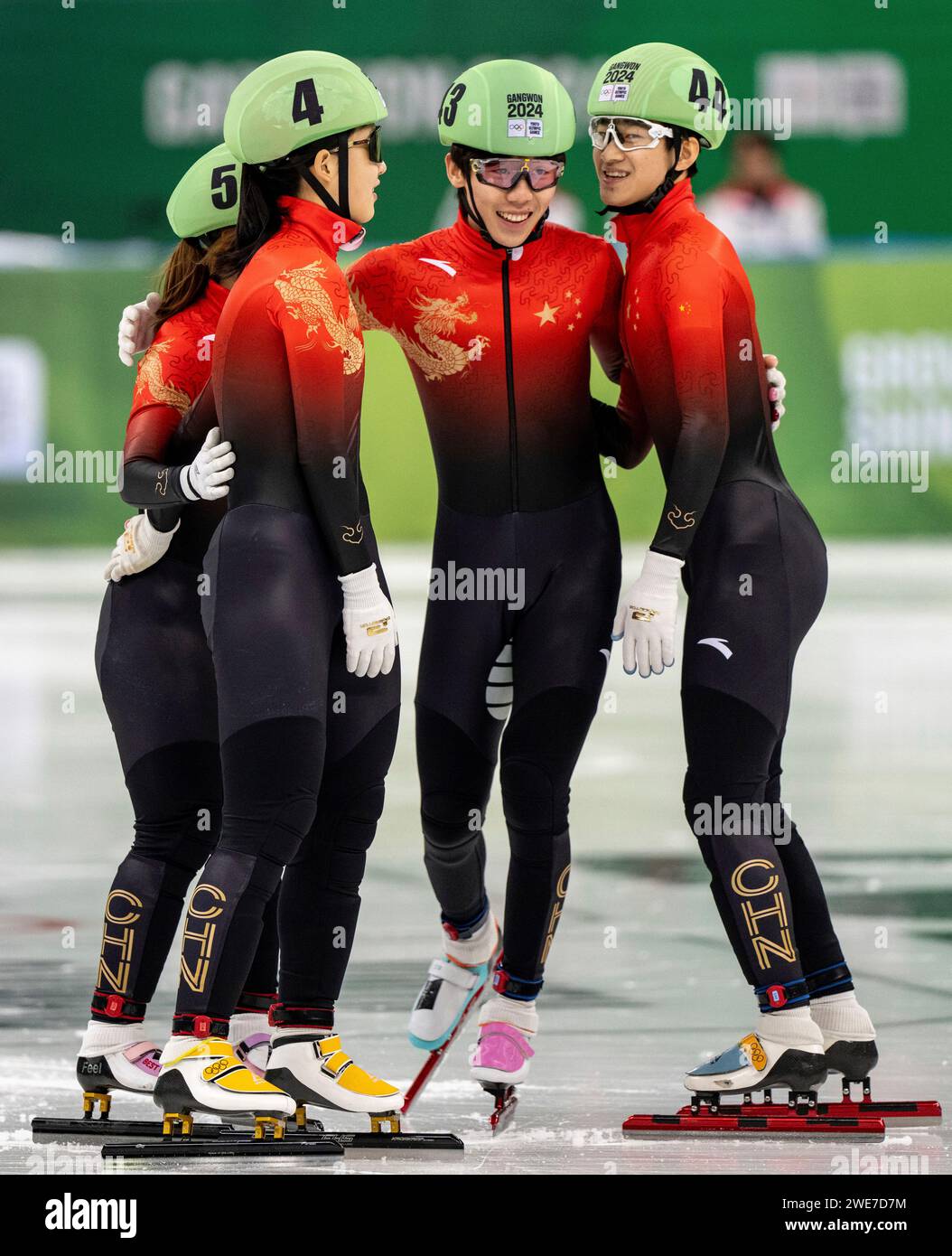 China's Li Jinzi, Yang Jingru, Zhang Bohao and Zhang Xinzhe celebrate after winning gold in the ...