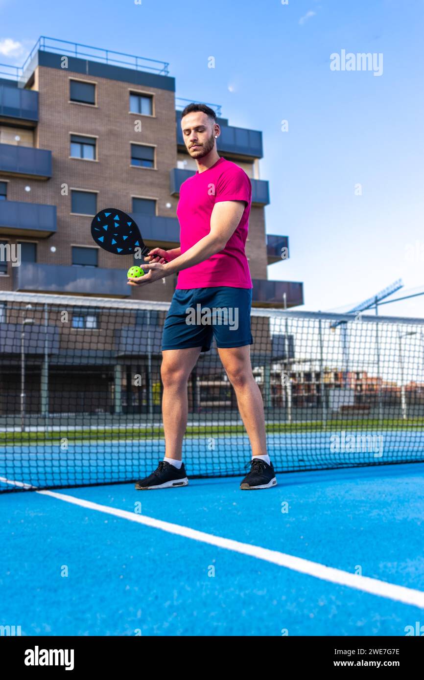 Portrait of a man posing looking at camera prepared to play a game of ...