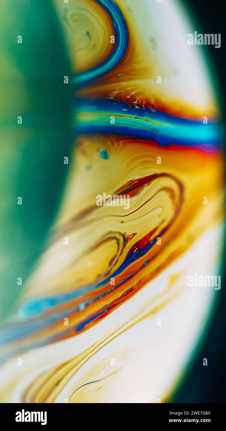 Neon paint holographic fluid rainbow oil ink mix Stock Photo - Alamy