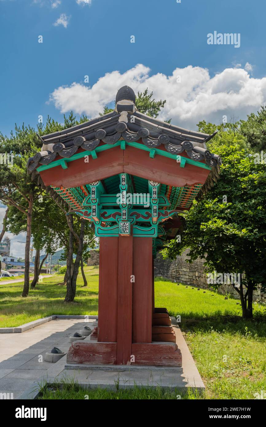 Side view of oriental information board with tiled roof at urban park ...