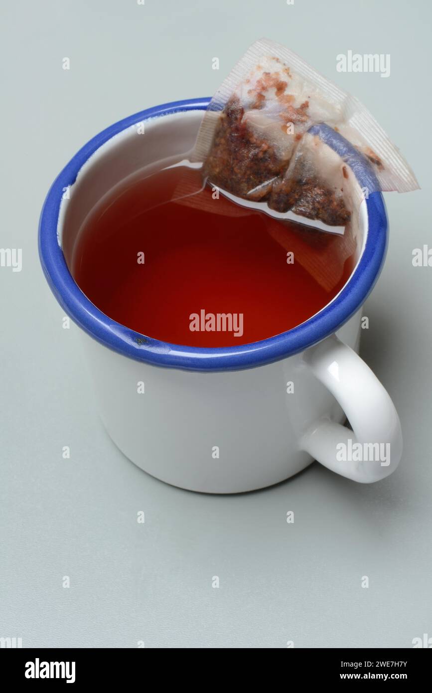 Red fruit tea in mug with tea bag, tea Stock Photo - Alamy