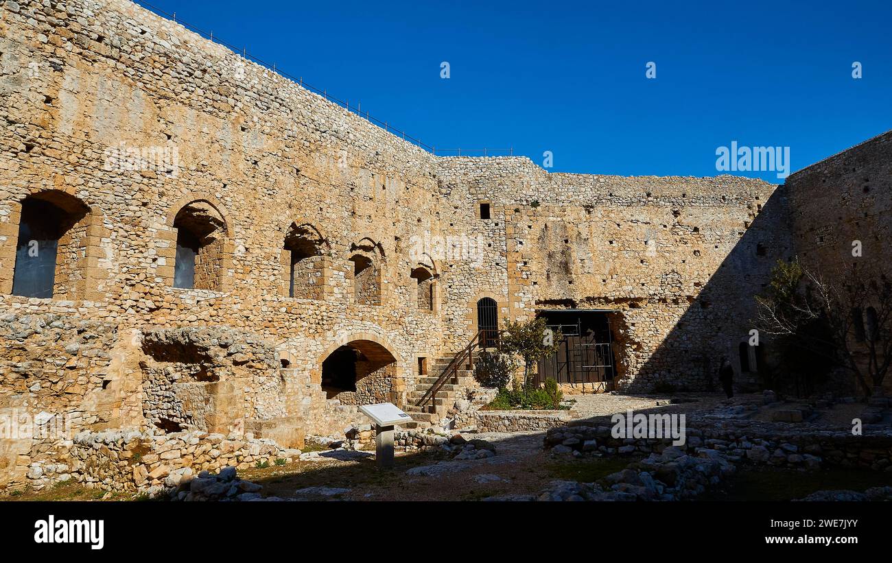Walls of a historic fortress with arched windows under a clear sky ...
