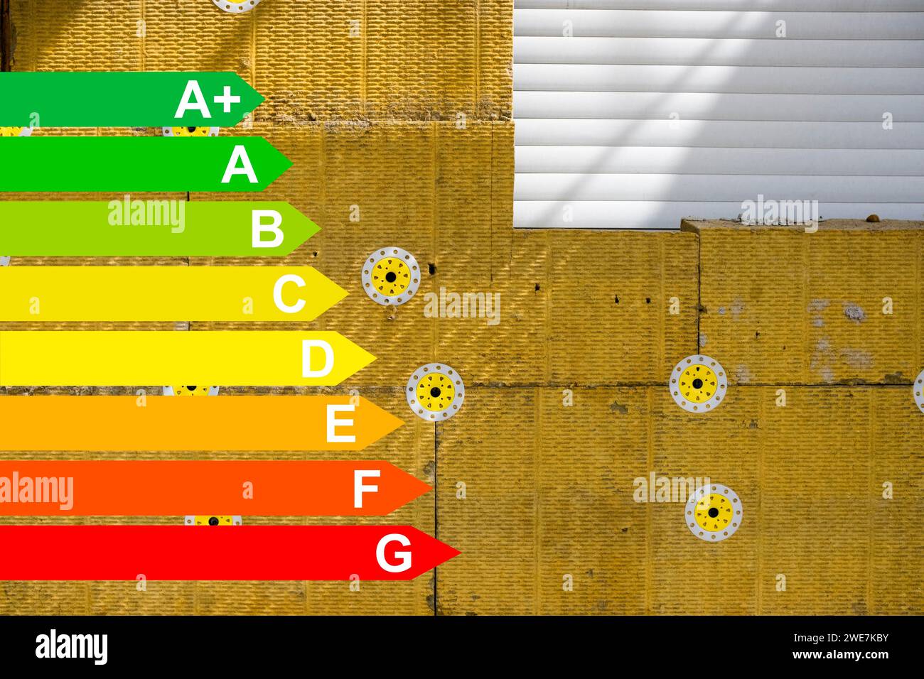 Insulation of a facade with mineral fibre boards, graphic with energy ...