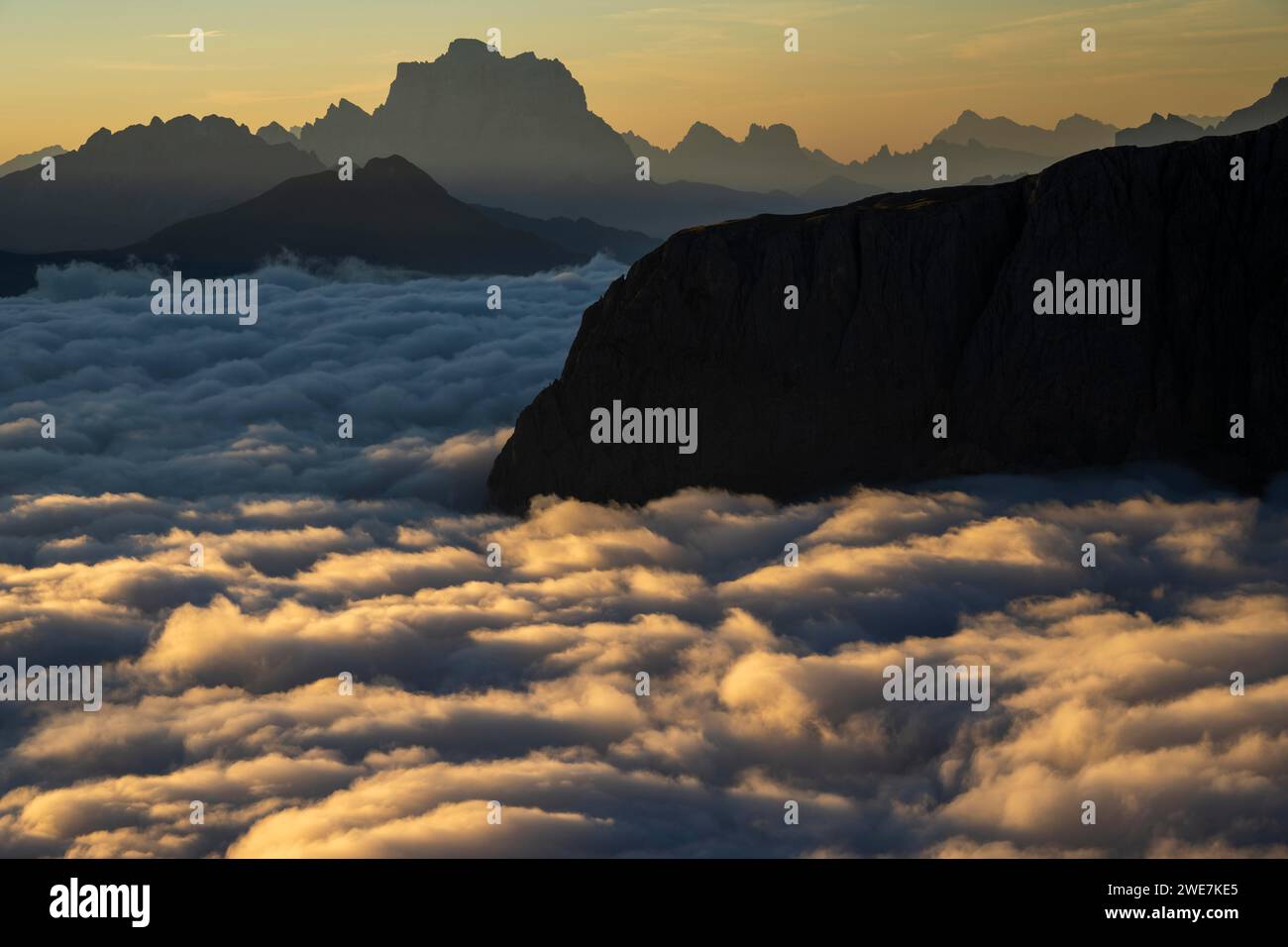 Sunrise over a sea of fog and Dolomite peaks in the background, Corvara ...