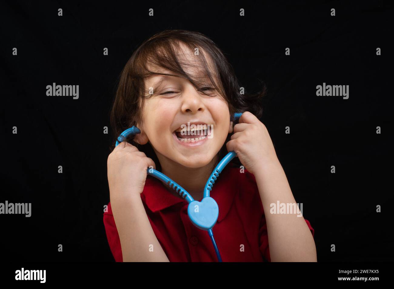 Intelligent little boy future doctor holds stethoscope Stock Photo - Alamy