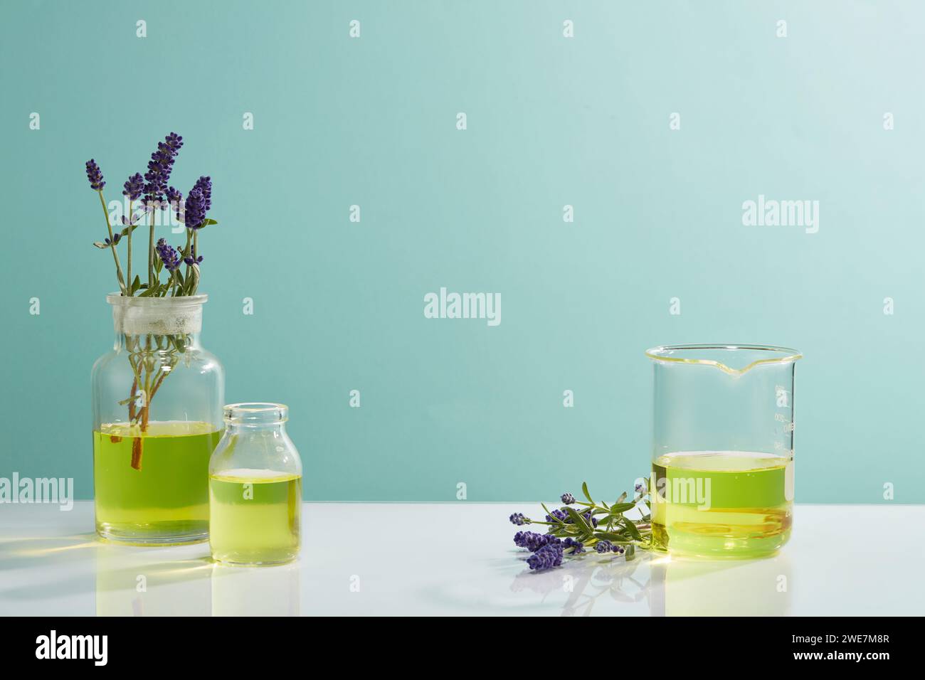 Vacant space in the middle with some glassware filled with yellow ...