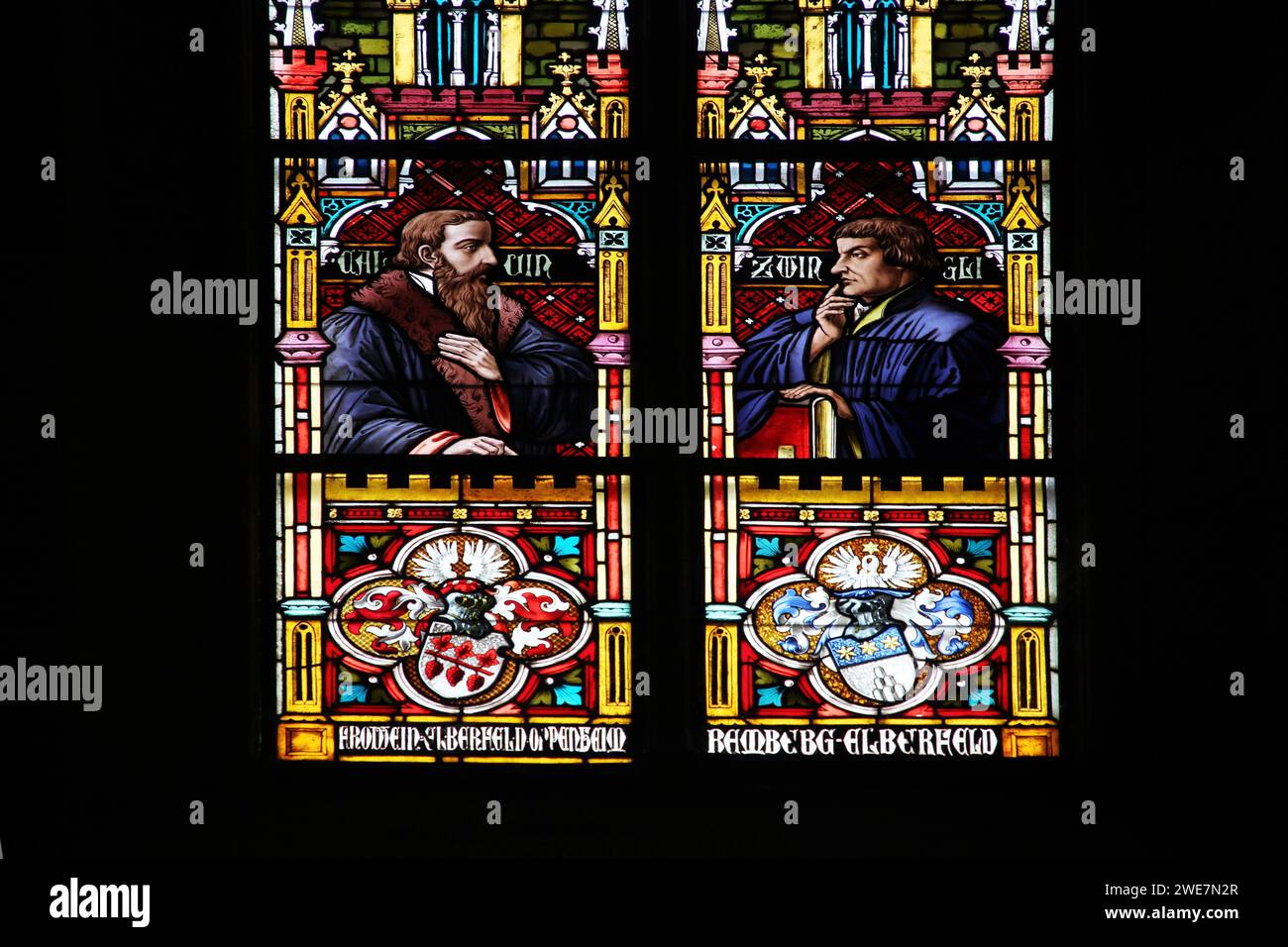 Colourful stained glass window with reformers Johannes Calvin and ...