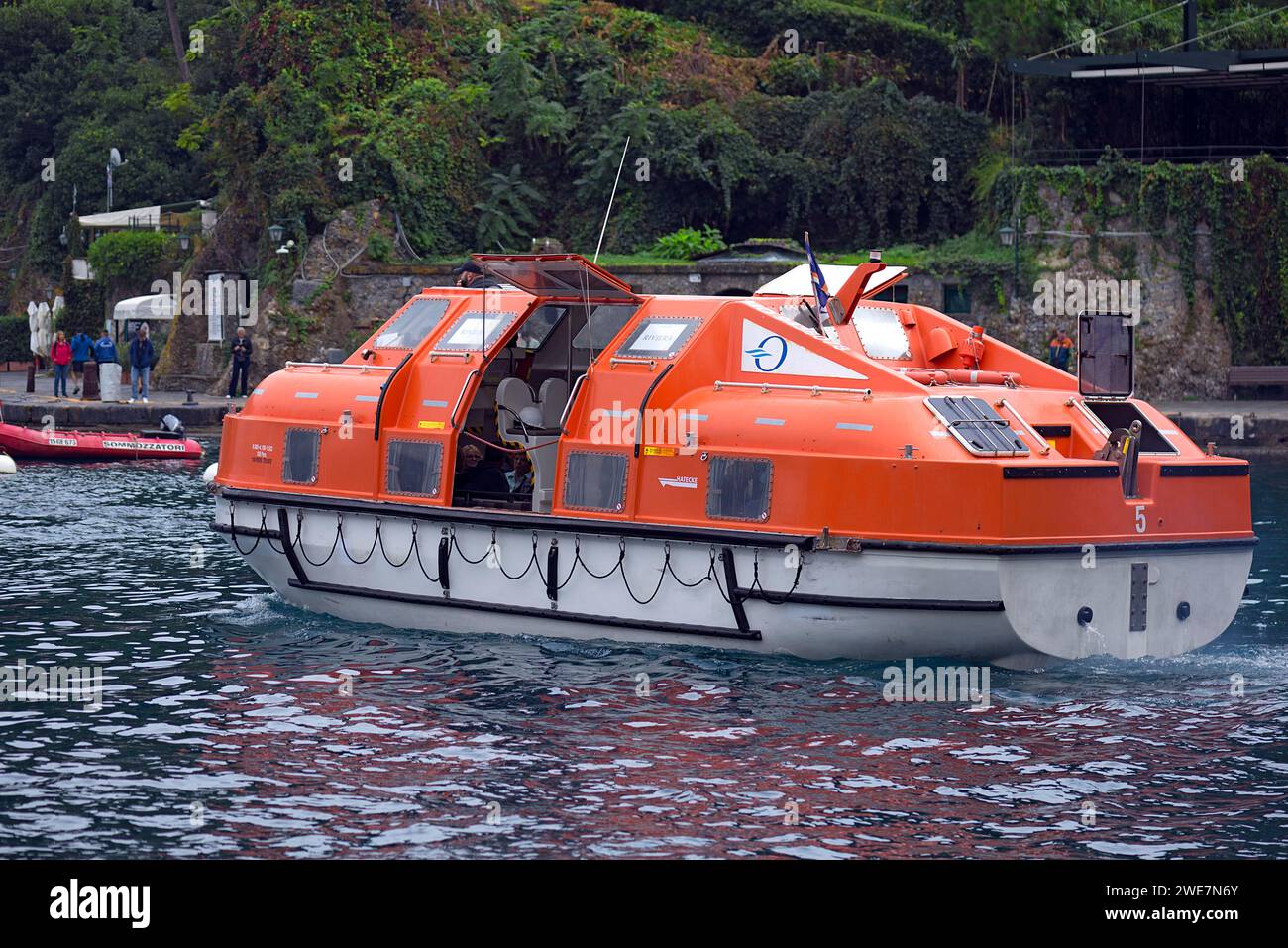 Closed lifeboat of a cruise ship in the harbour of Portofino, Italy ...