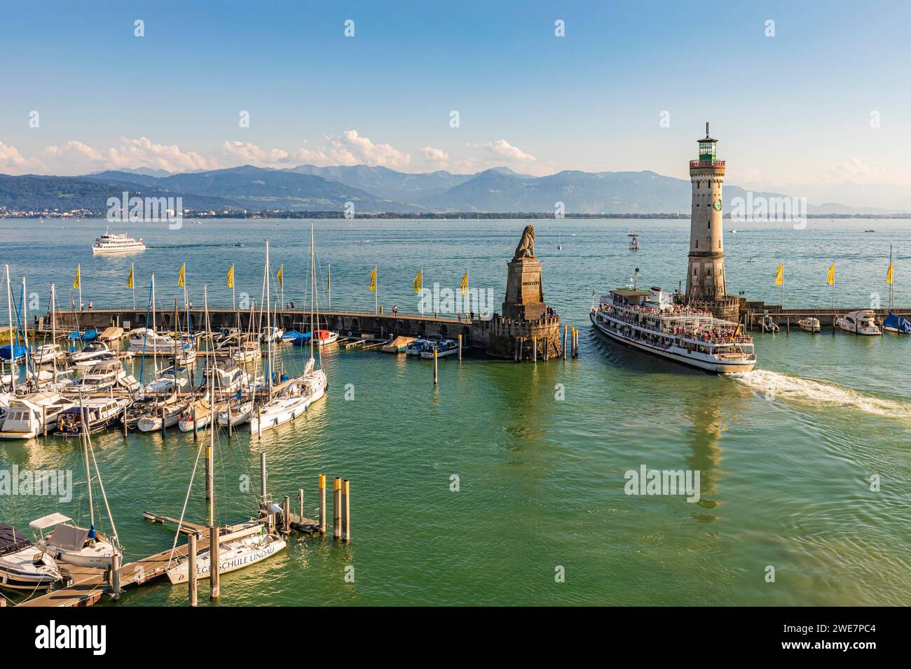 Harbour with boats, Bavarian Lion, lighthouse and an excursion boat ...