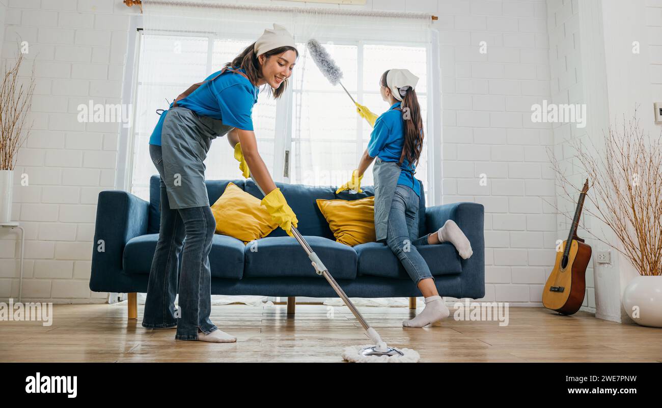 Two women cleaning team hi-res stock photography and images - Alamy
