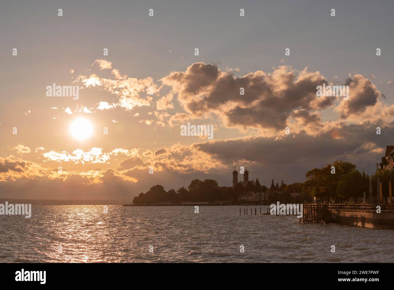 Baroque castle church, double tower, onion dome, evening light ...