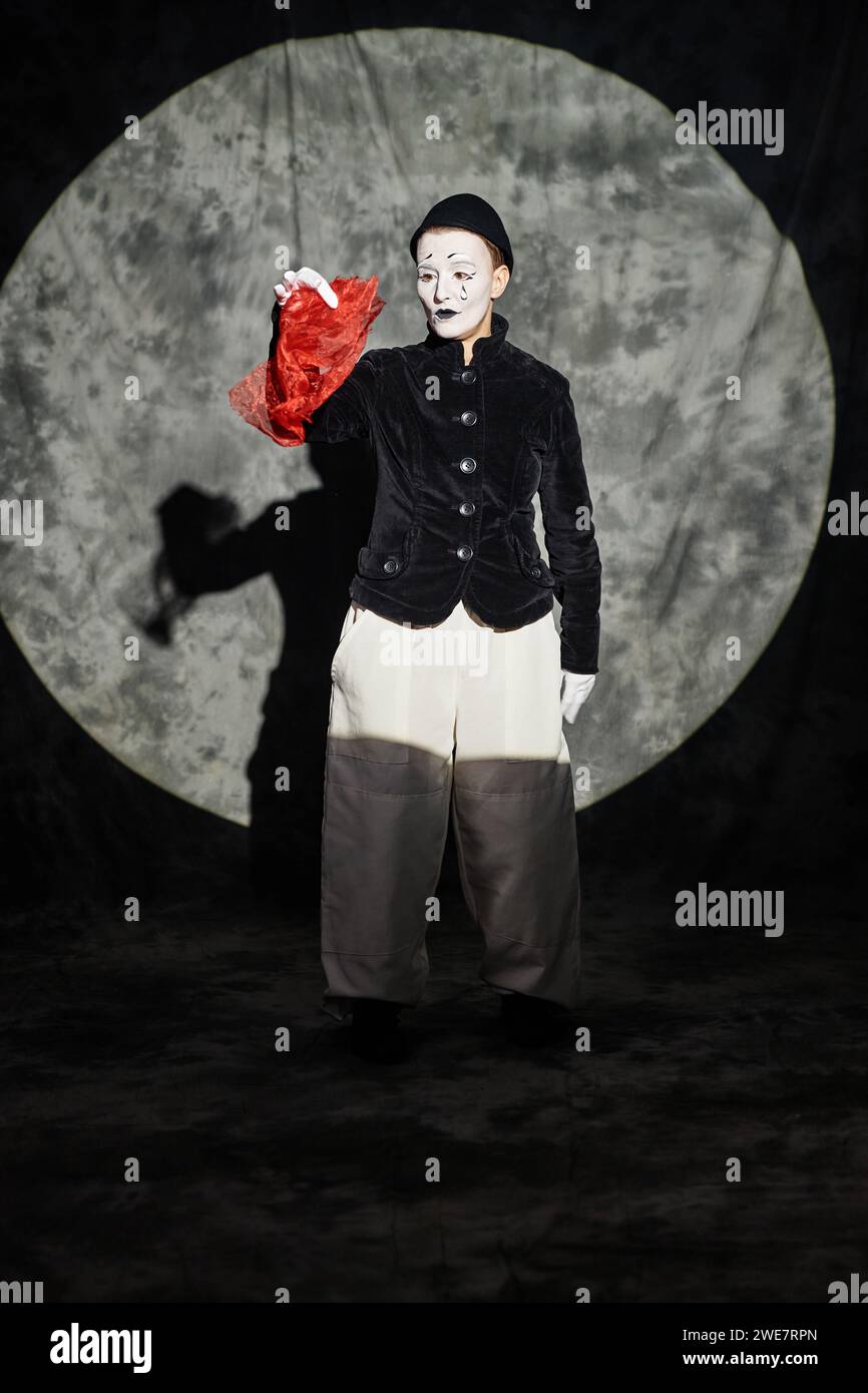 Minimal full length shot of mime artist performing on stage in black ...