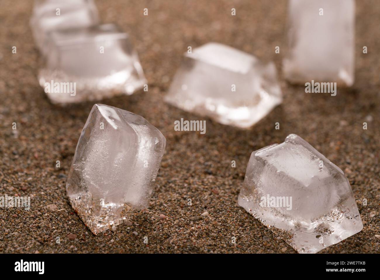 ice cubes are melting into sand Stock Photo - Alamy