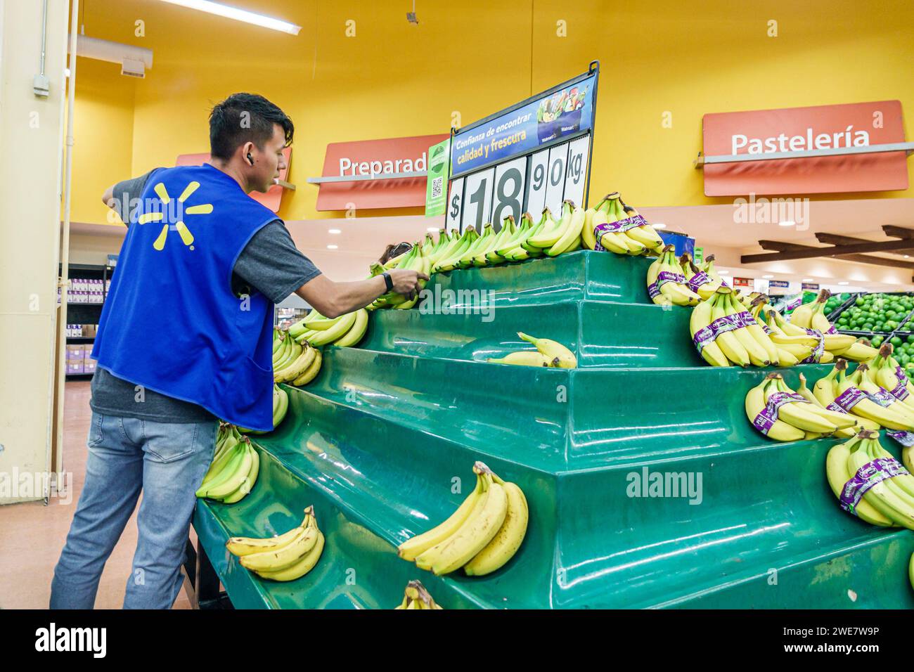 Employee restocking bananas hi-res stock photography and images - Alamy