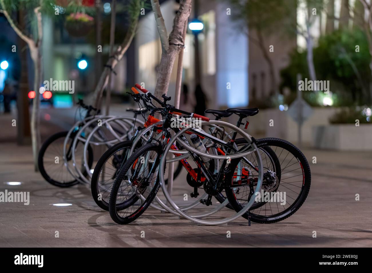 Bicycles locked to stands in street of Musheireb Downtown Doha Qatar ...