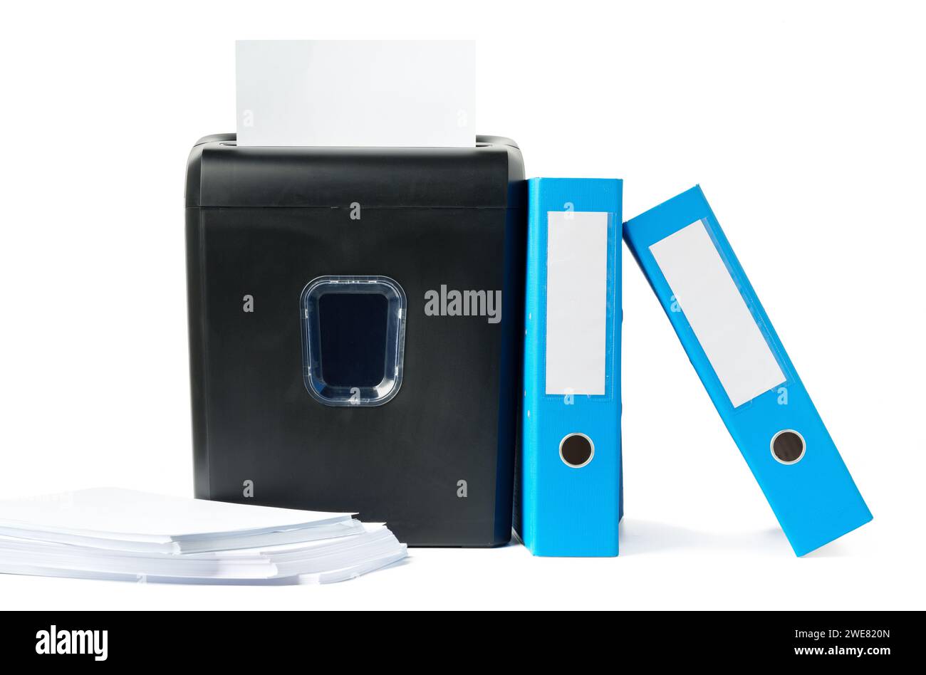 Office paper shredder on table against gray background Stock Photo - Alamy