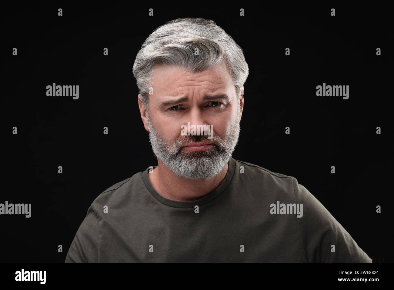 Personality concept. Portrait of emotional man on black background ...