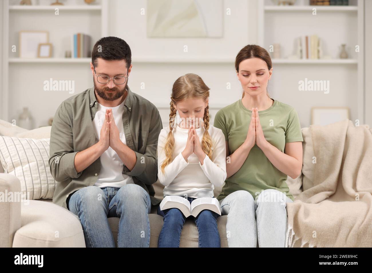 Kid praying parent hi-res stock photography and images - Alamy