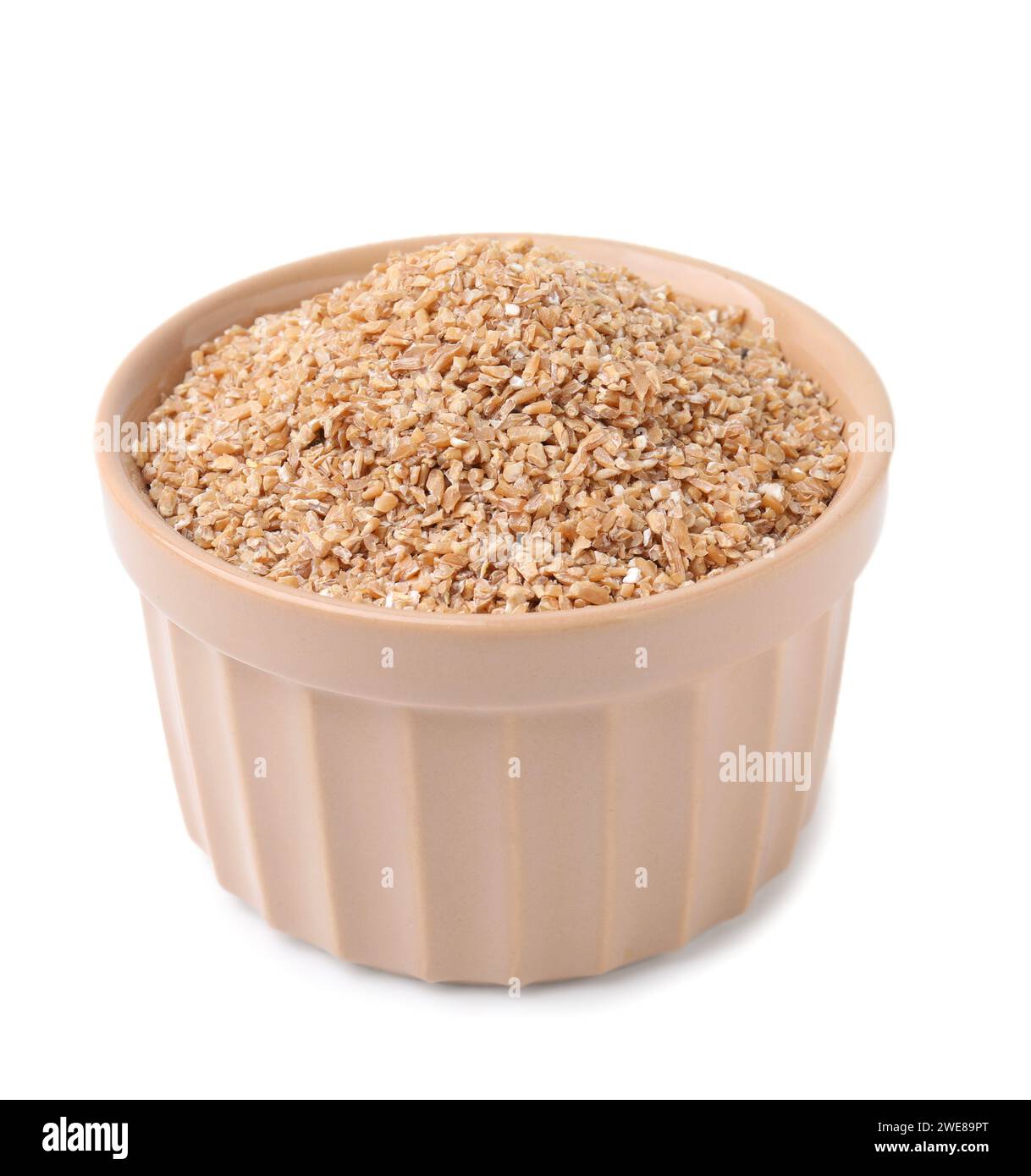 Dry wheat groats in bowl isolated on white Stock Photo - Alamy