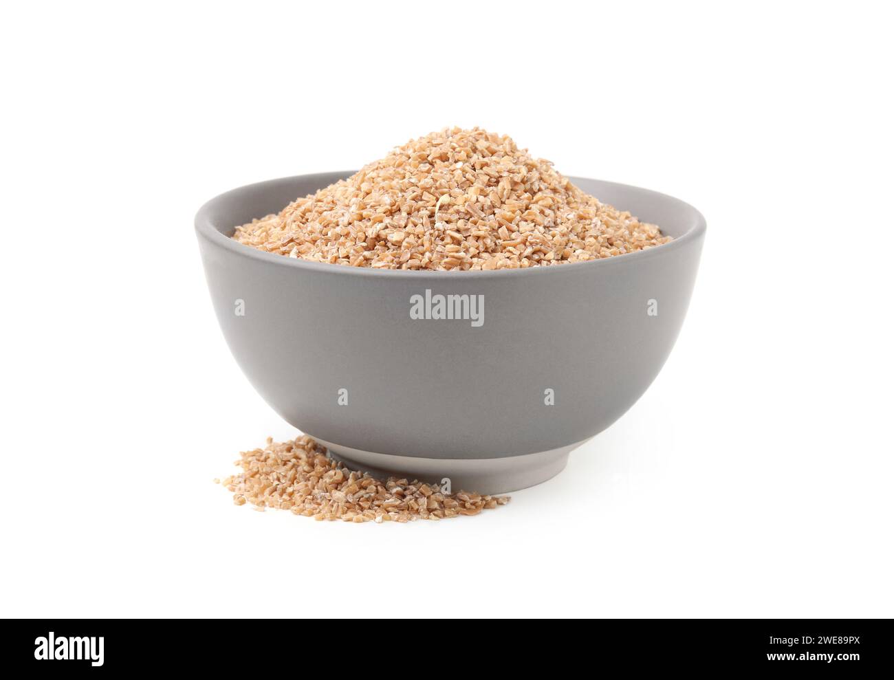 Dry wheat groats in bowl isolated on white Stock Photo - Alamy