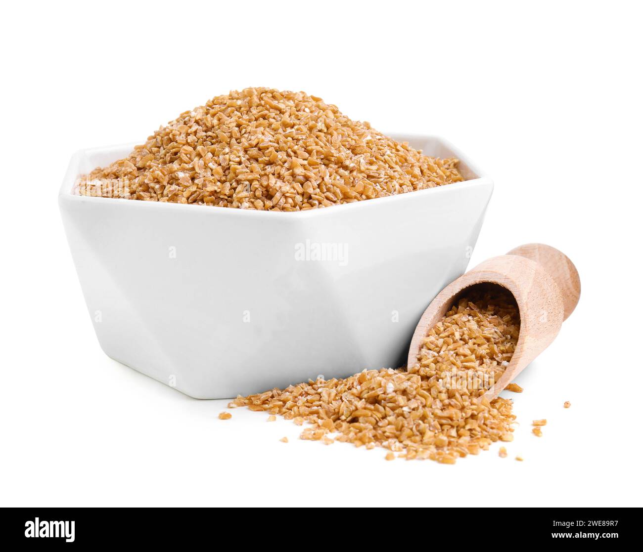 Dry wheat groats in bowl and scoop isolated on white Stock Photo - Alamy