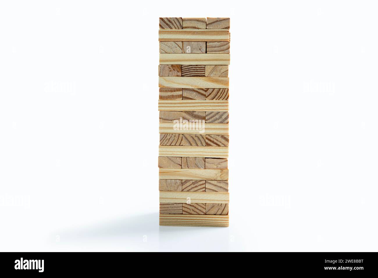 Closeup view of the tower of the wooden block on a white background ...