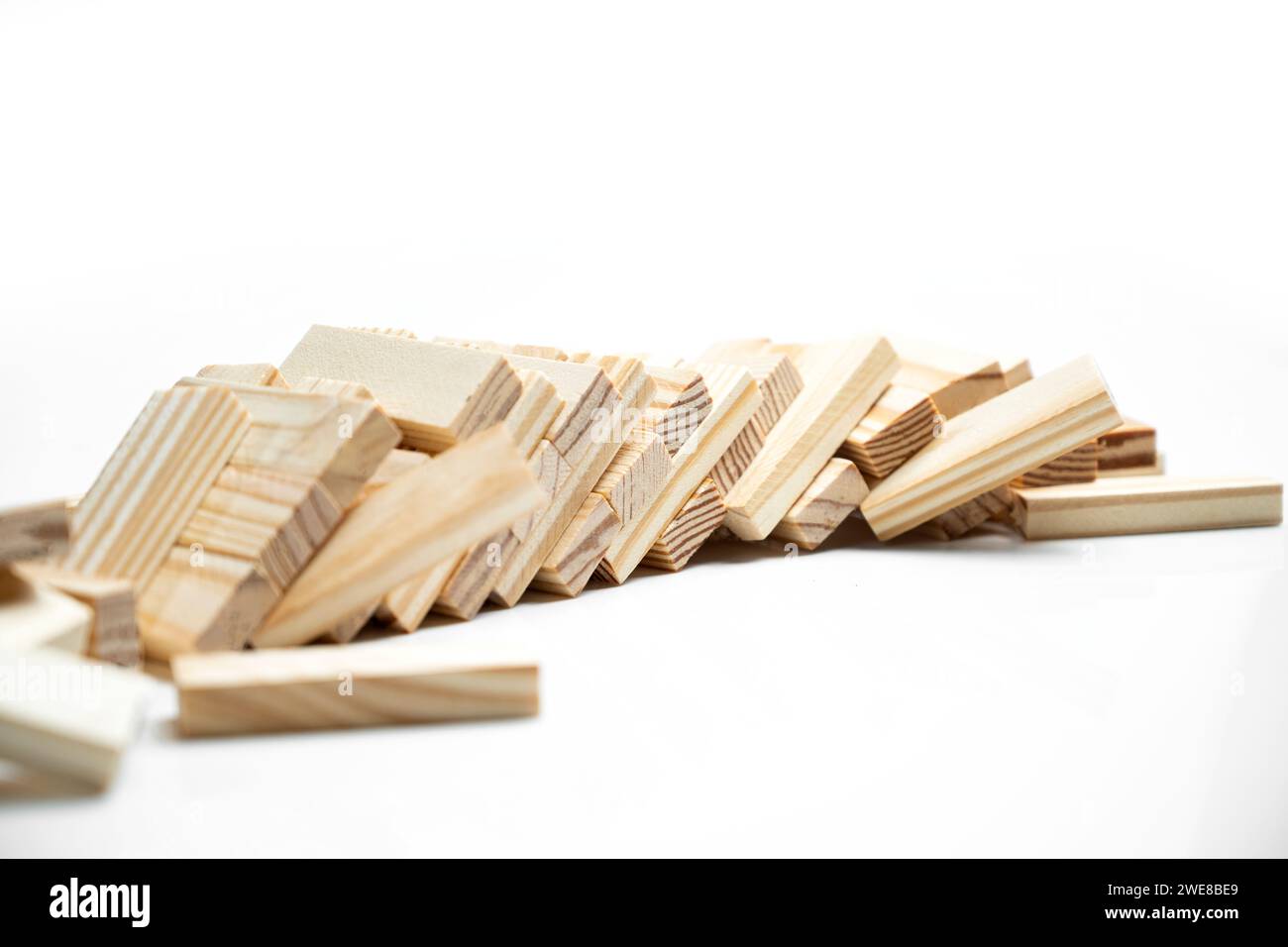 Closeup view of the tower of the wooden block falling on a white ...
