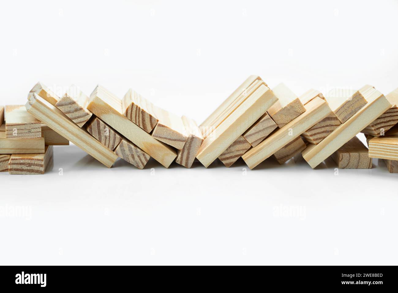 Closeup view of the tower of the wooden block falling on a white ...