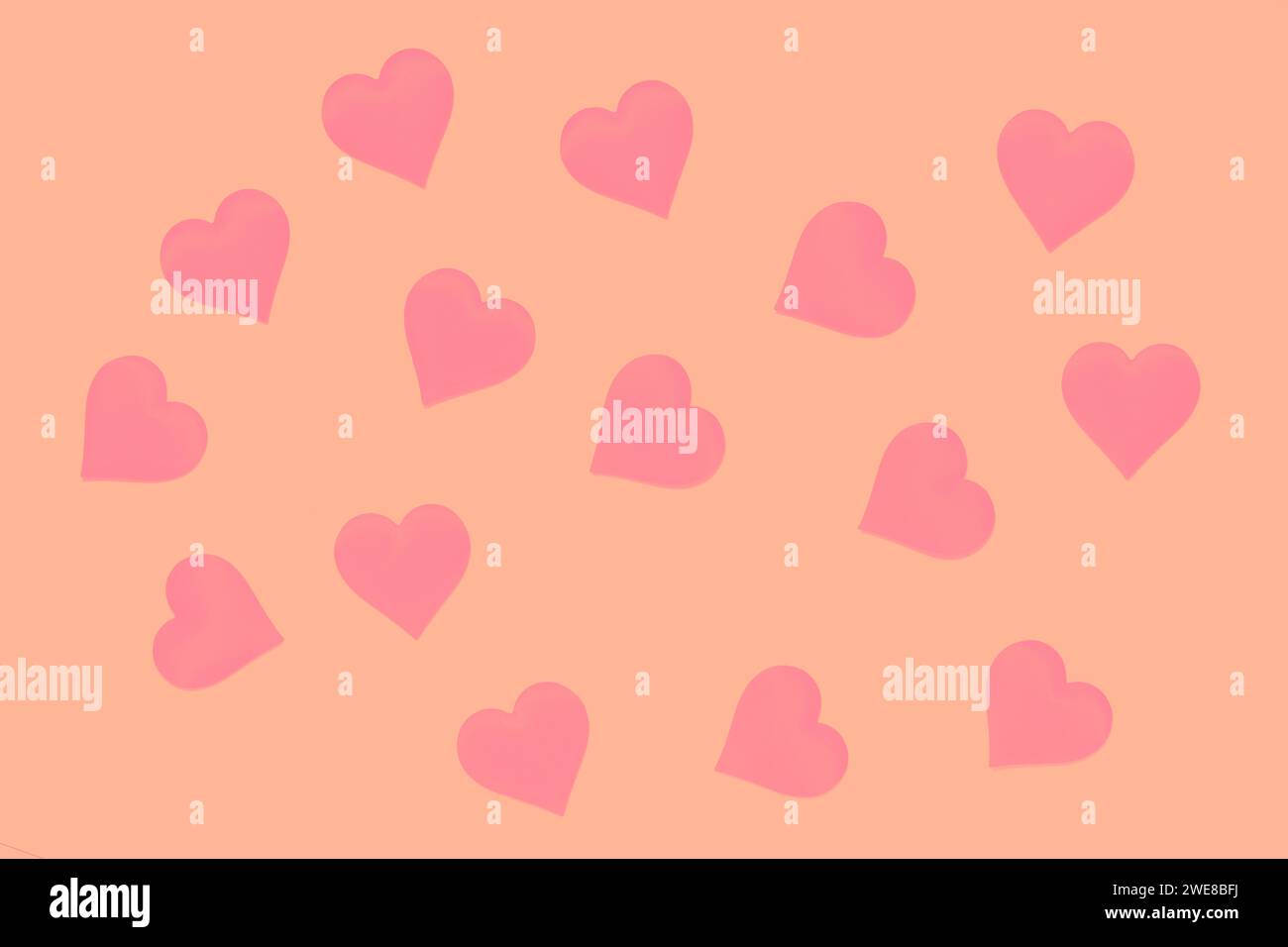 tinted photograph, pink, peach fuzz color. pink hearts on a pink ...
