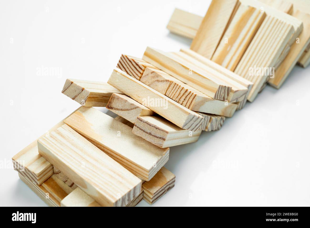 Closeup view of the tower of the wooden block falling on a white ...