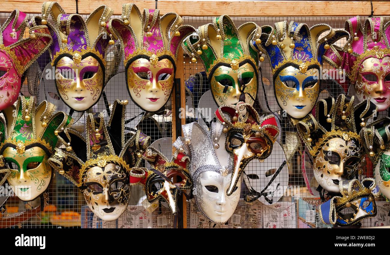 Traditional venetian masks on shelves in souvenirs shop in Venice ...