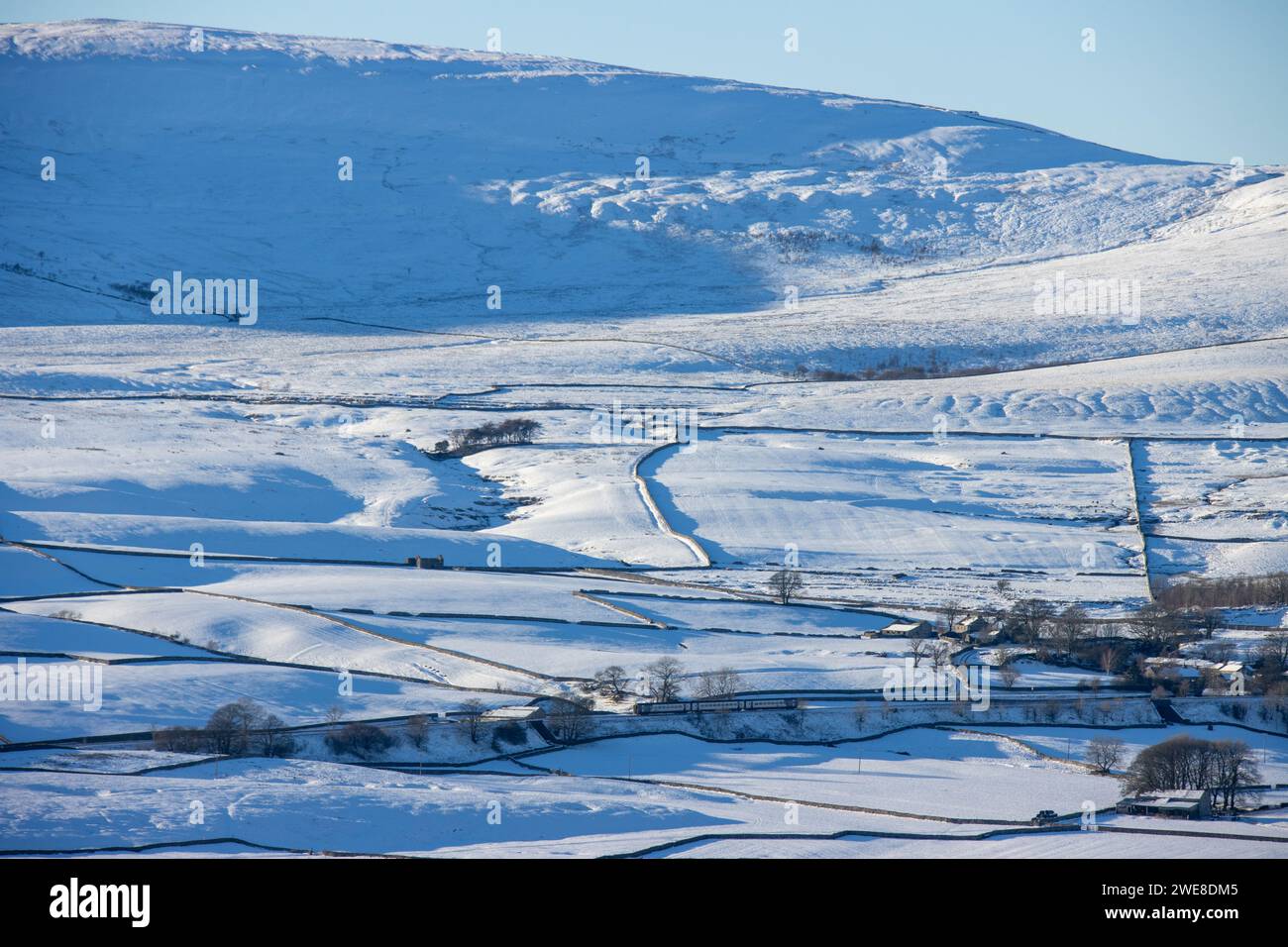 Fields crisscrossed by drystone walls in winter in the Yorkshire Dales ...