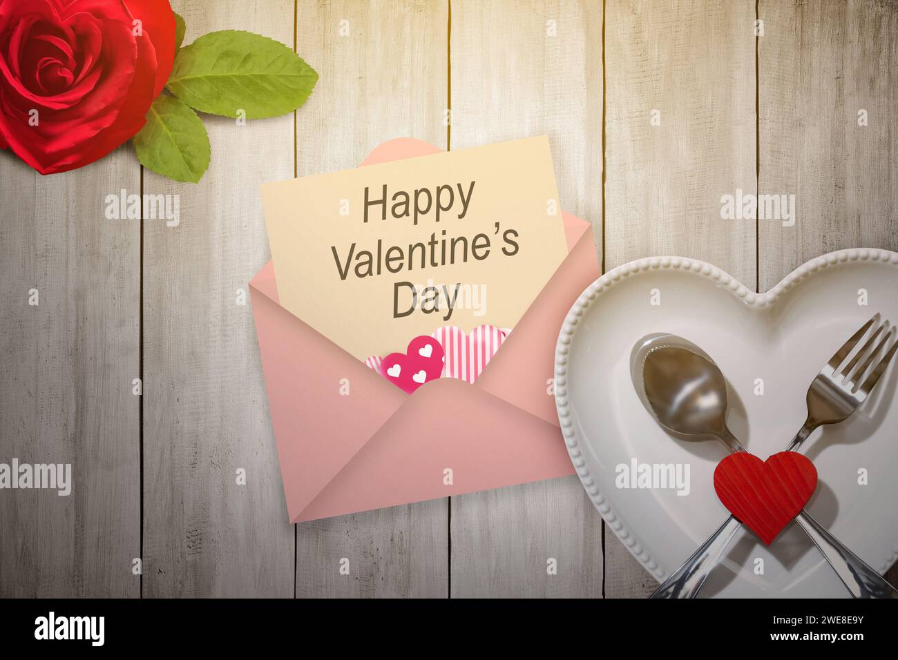 Heart plate with silverware of spoon and fork with a red heart and ...