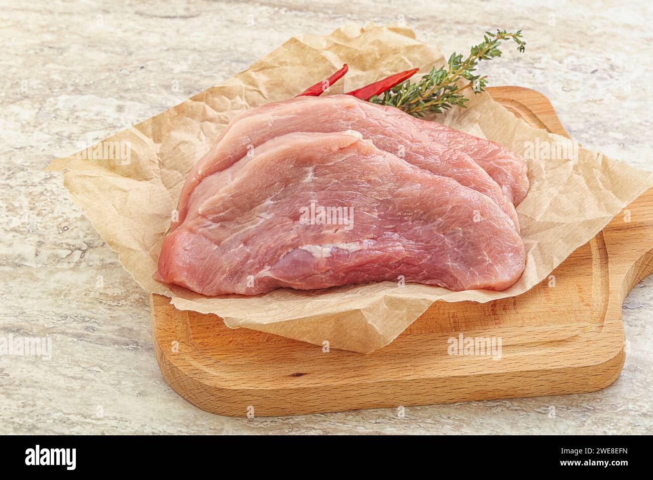Raw pork schnitzel cut for roast Stock Photo - Alamy