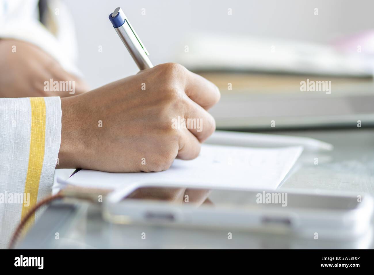 Female student paper pen hi-res stock photography and images - Alamy