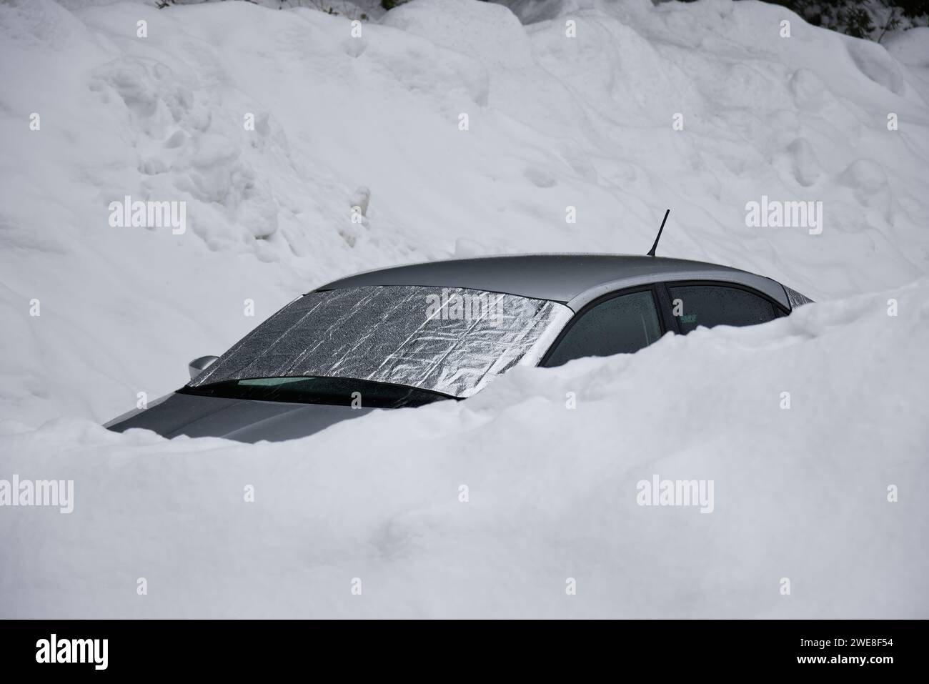 Car Blanketed in Heavy Snow with Aluminum Windshield Protection Stock ...