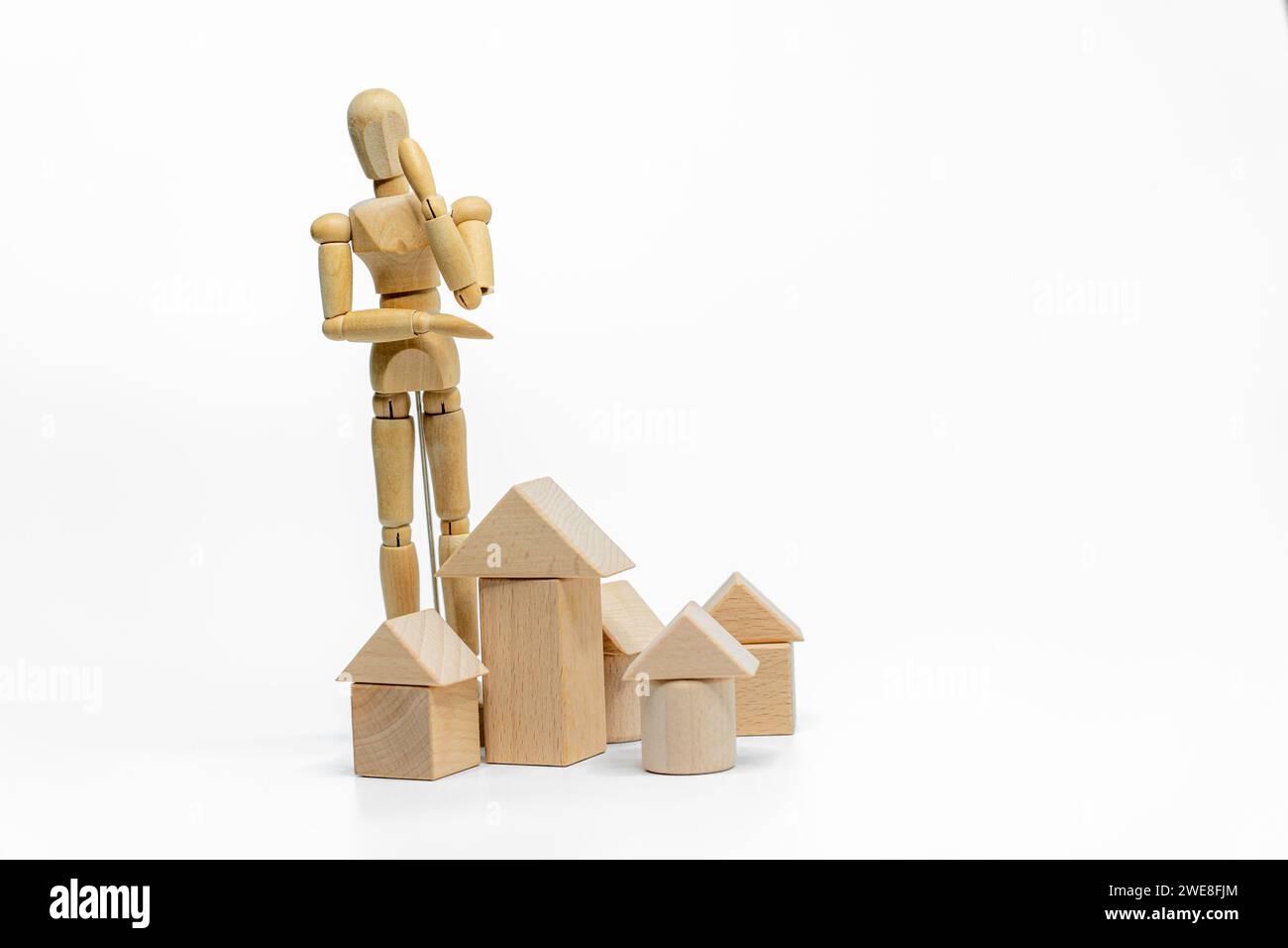 Wooden doll with wooden toy block isolated on white background ...